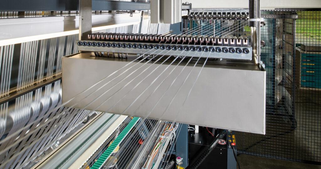 Flexible warp knitting machine with weft insertion and more - Knitting ...
